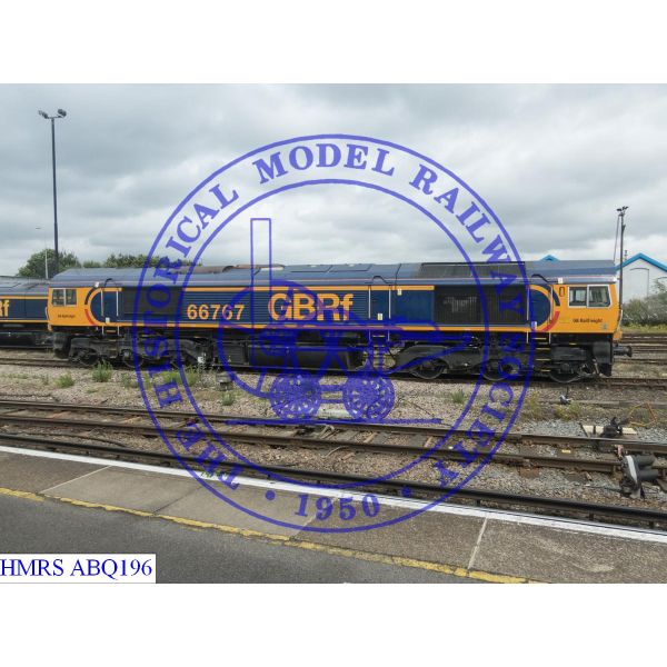 [ABQ196] 66767 in GB Railfreight blue and orange livery. Angled side ...